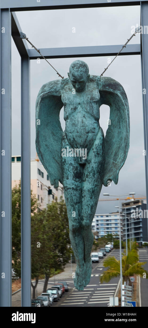 Hanging angel street art memorial to Maderian workers, Funchal, Madeira ...