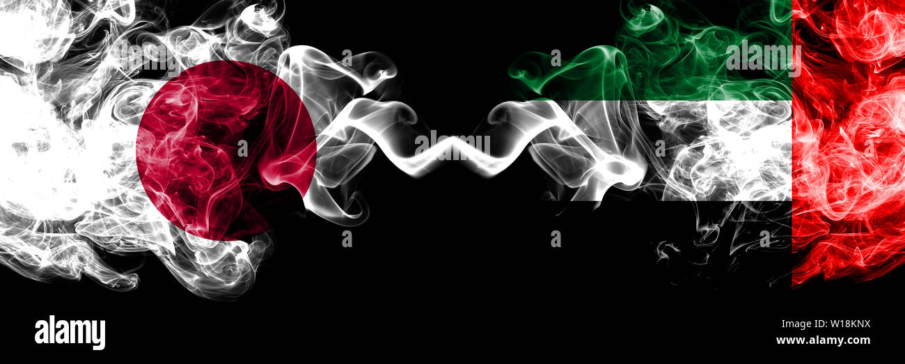 Japan vs United Arab Emirates, Emirati smoky mystic flags placed side ...