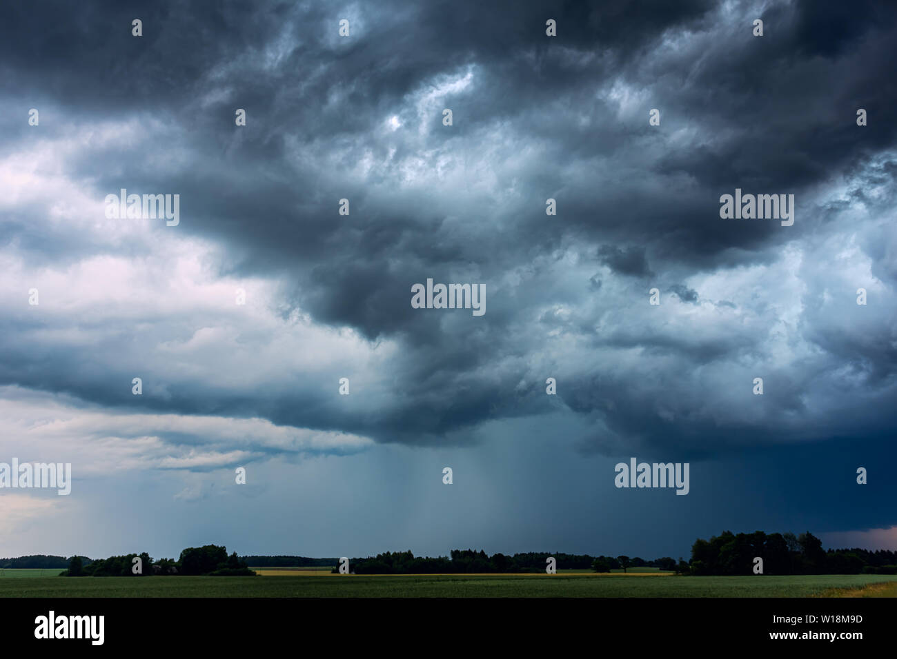 Tropic storm clouds with micro burst rain Stock Photo - Alamy