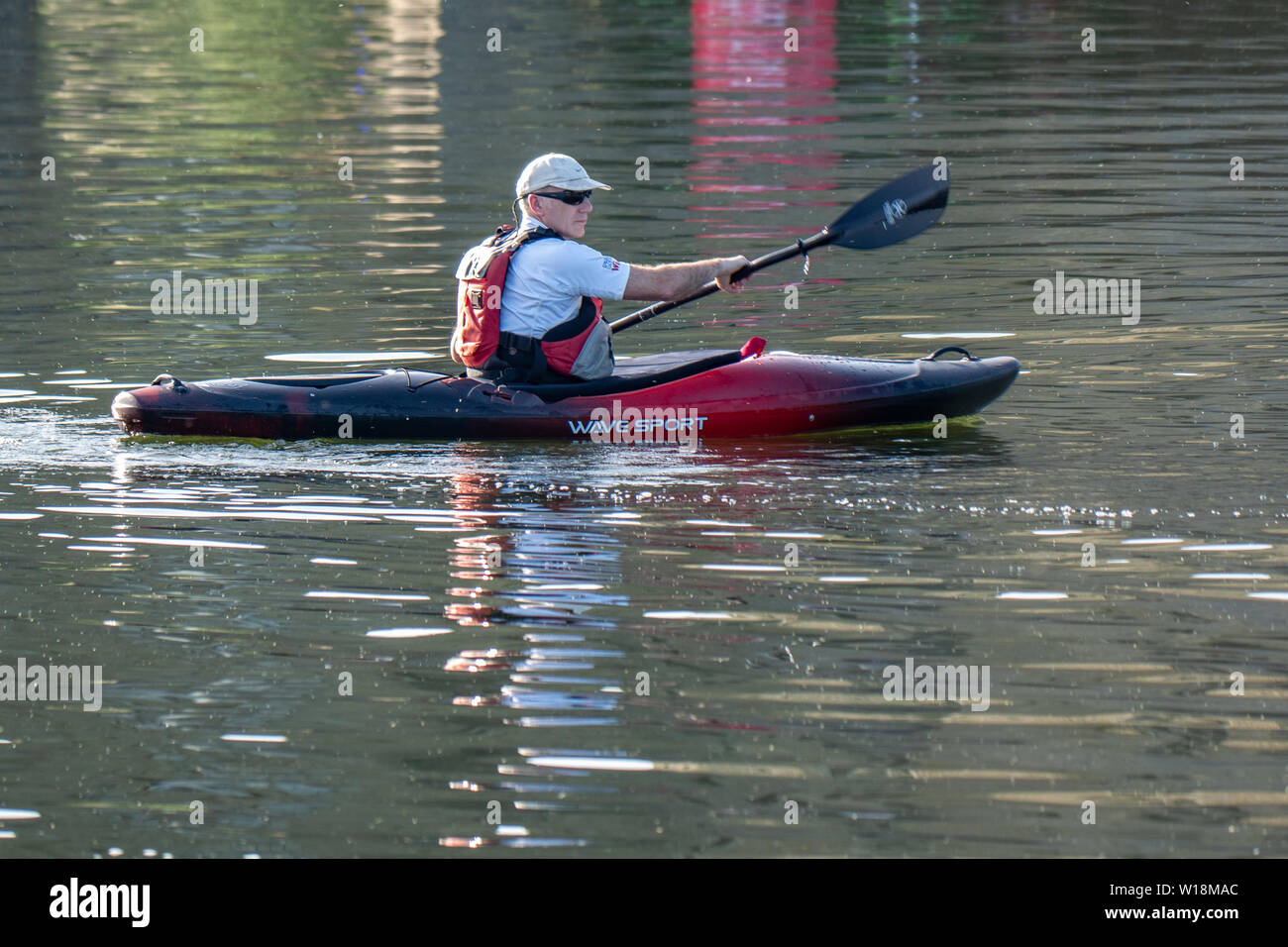 Leeds Castle triathlon 2019 - safety canoe Stock Photo - Alamy