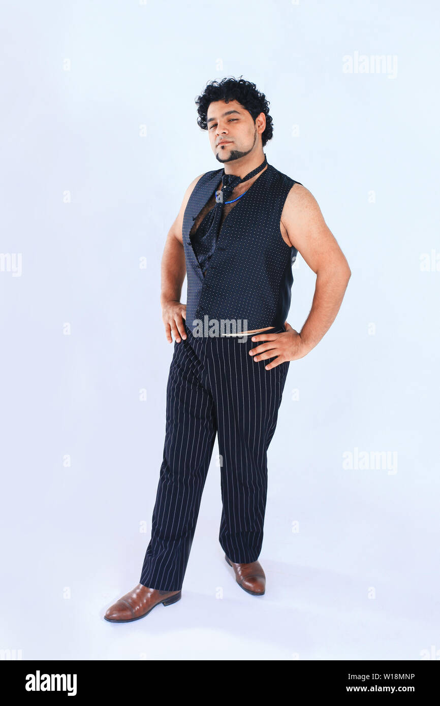 stylish man dancer posing for the camera .isolated on a white ...