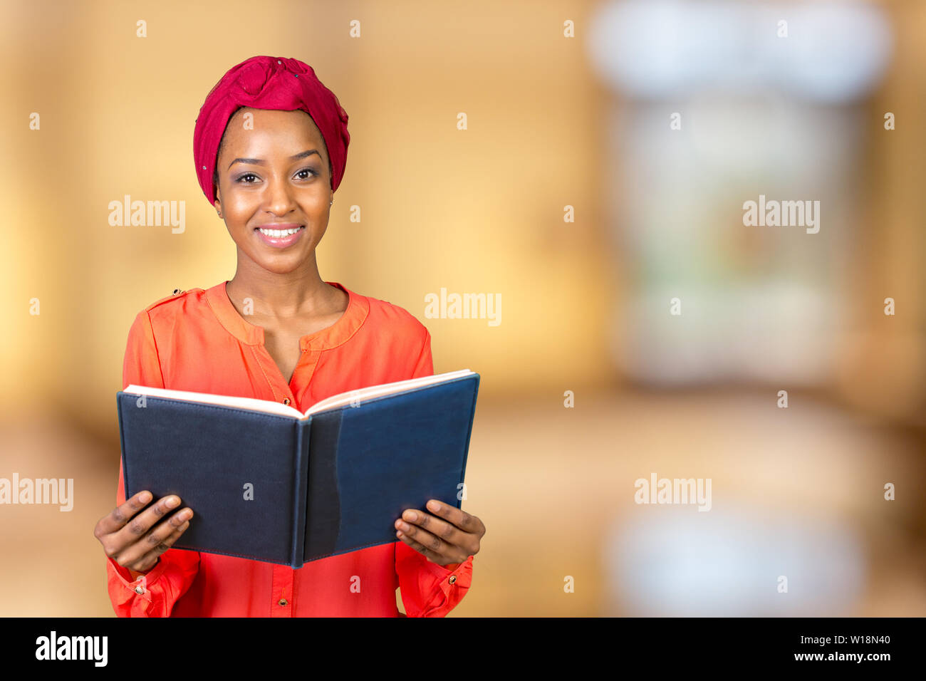 African american student with books Stock Photo - Alamy