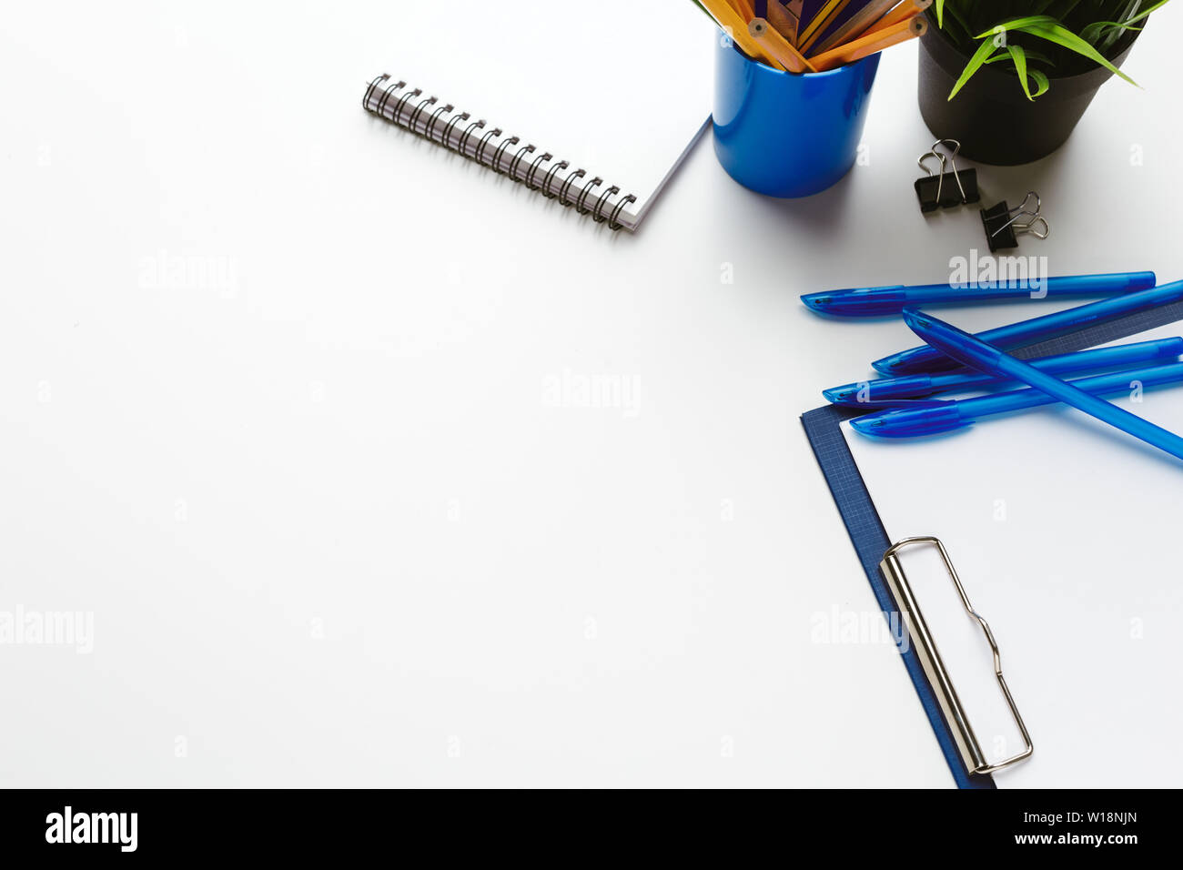 Business Items dropped in creative Disorder on white Table Stock Photo ...