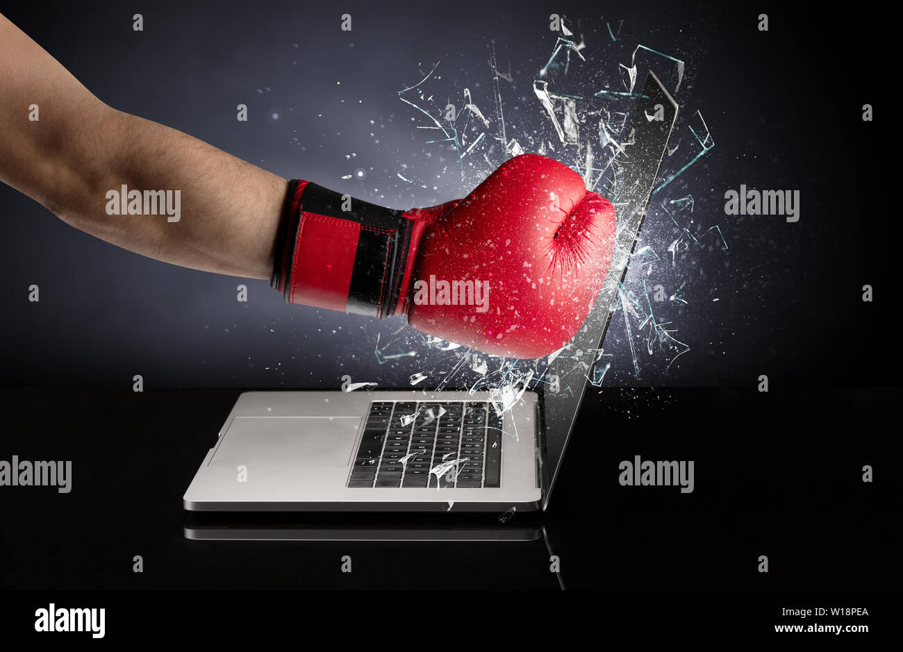 Hand hitting strongly laptop screen glass Stock Photo - Alamy