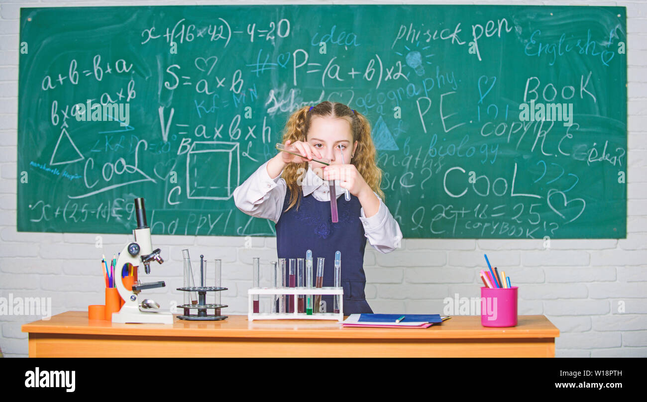 Girl smart student conduct school experiment. School pupil study ...