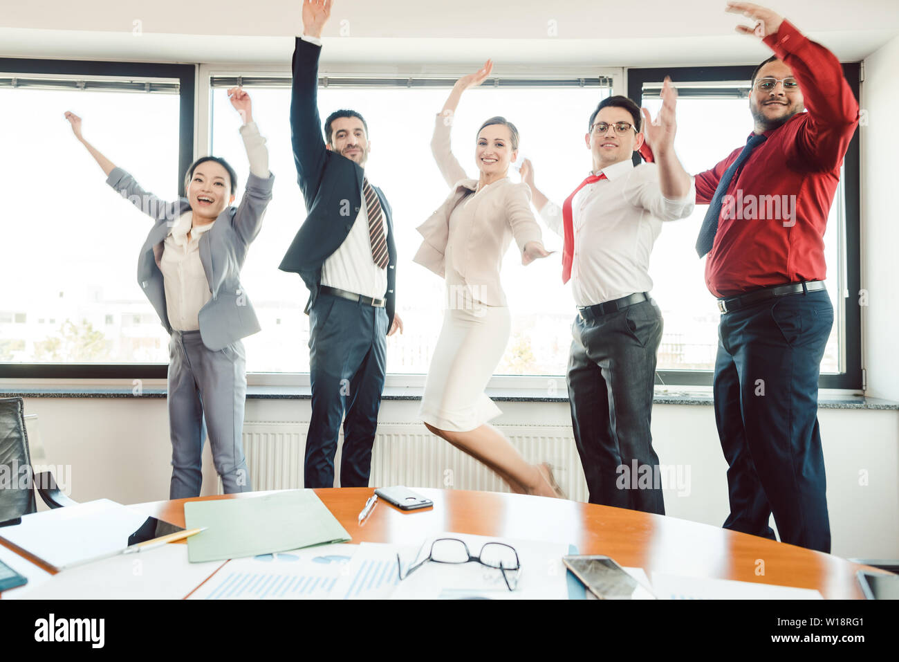 Jumping business team office workers jump hi-res stock photography and ...