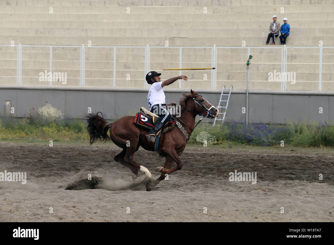 Ankara, Turkey. 30th June, 2019. A player throws javelin on horseback ...