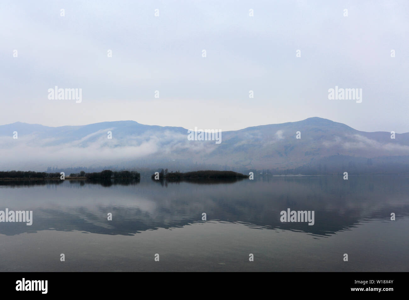 Mist over Derwentwater lake, Keswick town, Lake District National Park ...