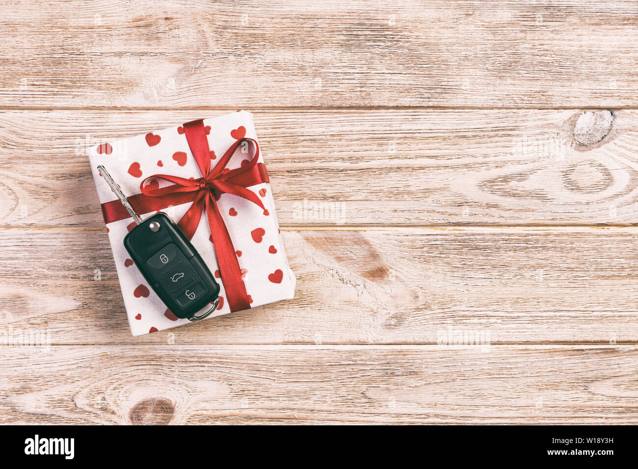 Valentine or other holiday handmade present in paper with red hearts ...