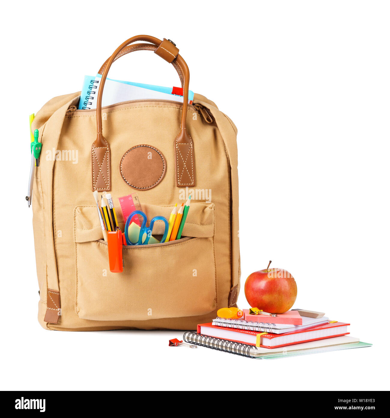 Brown school backpack full of various colorful stationery and supplies ...