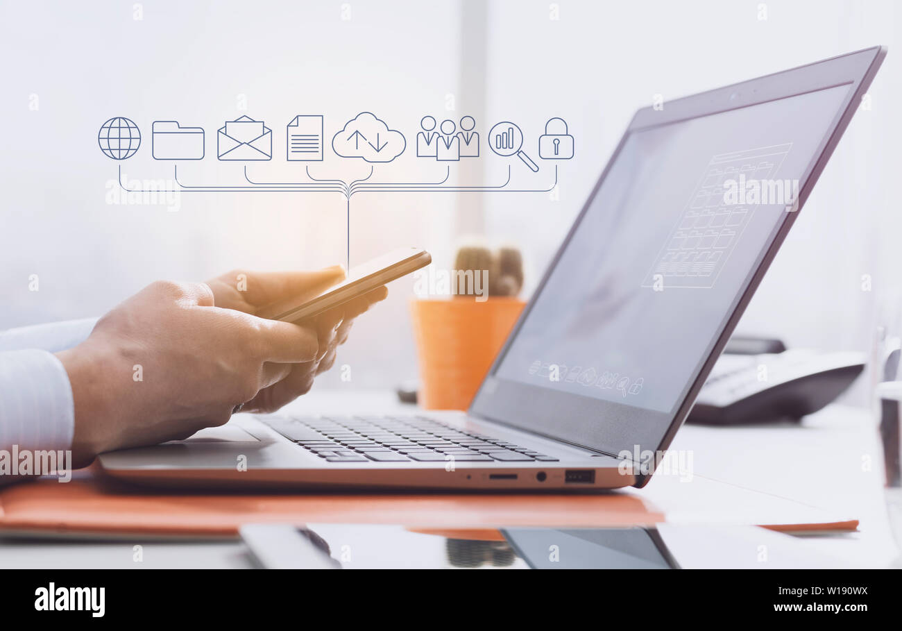 Corporate businesswoman using apps on her smartphone and interactive ...