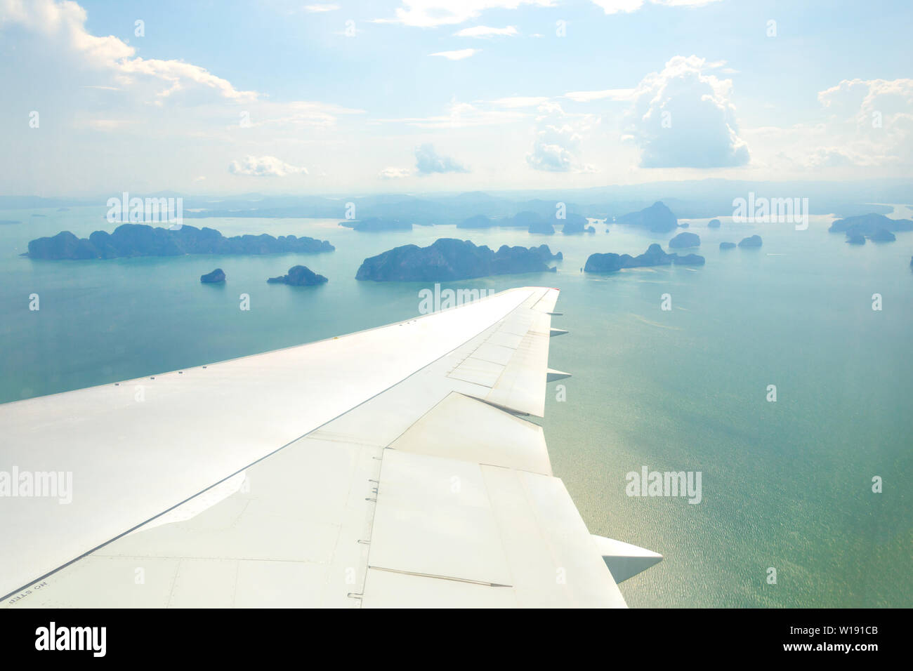 Wing of airplane from window Stock Photo - Alamy