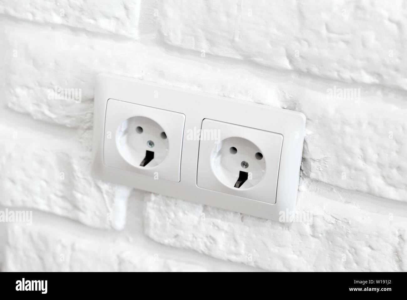 Power socket in concrete wall Stock Photo - Alamy
