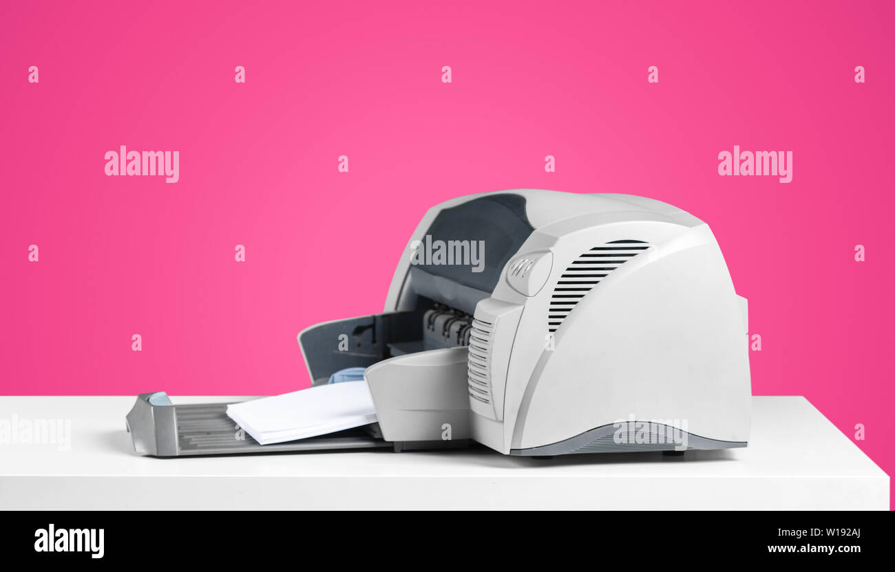 Printer copier machine on a bright colored background Stock Photo - Alamy