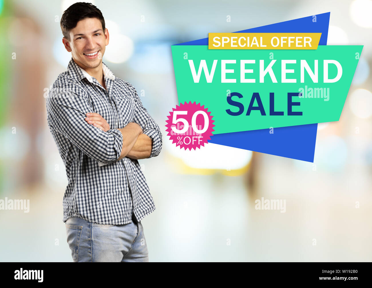 Young man promoting sale and special offers Stock Photo - Alamy