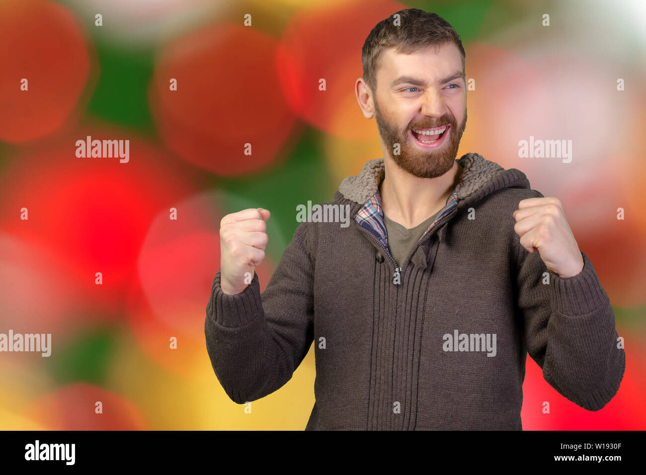 Successful man celebrating with arms up Stock Photo - Alamy