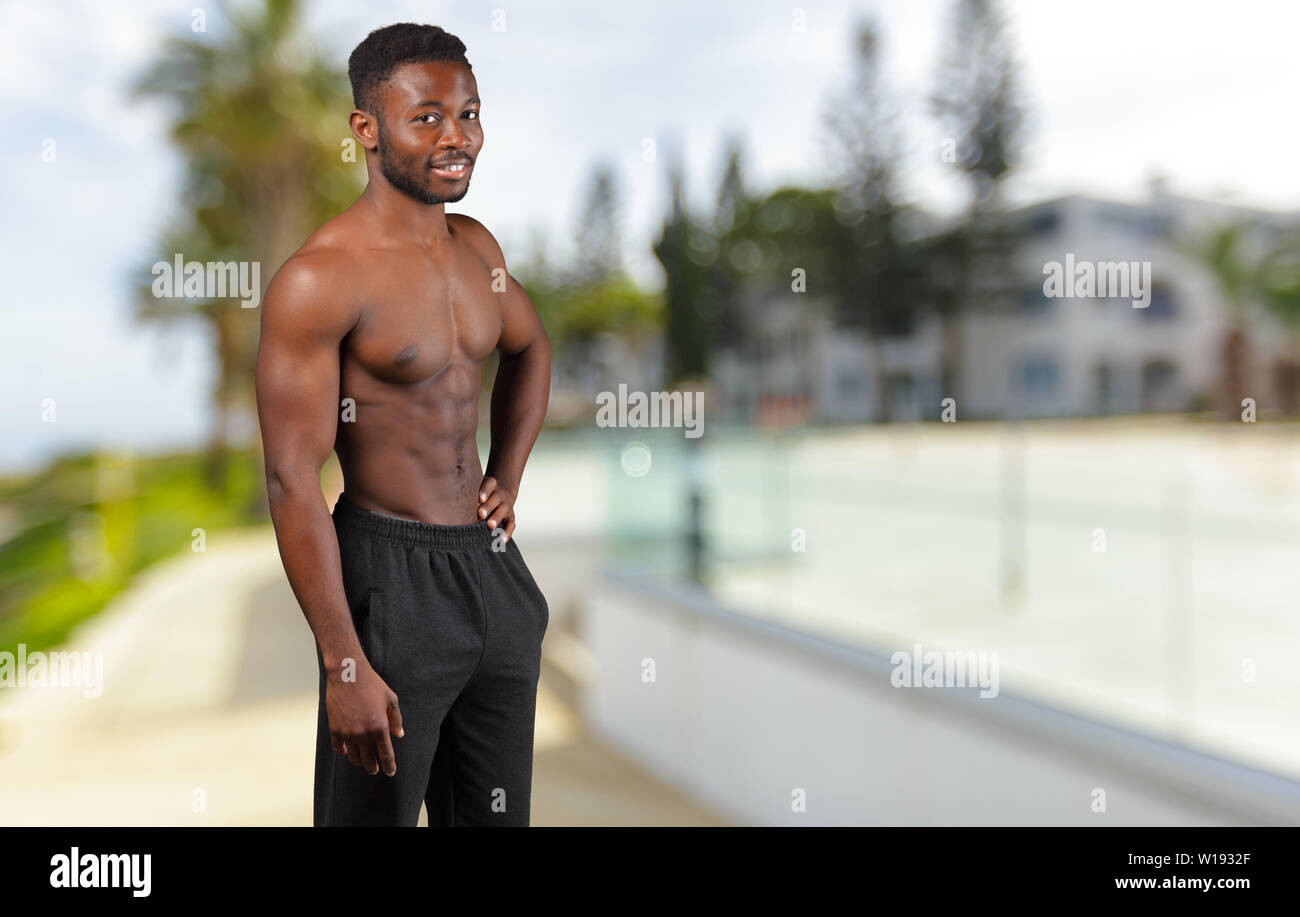 Enjoying healthy lifestyle. Young muscular African man Stock Photo - Alamy