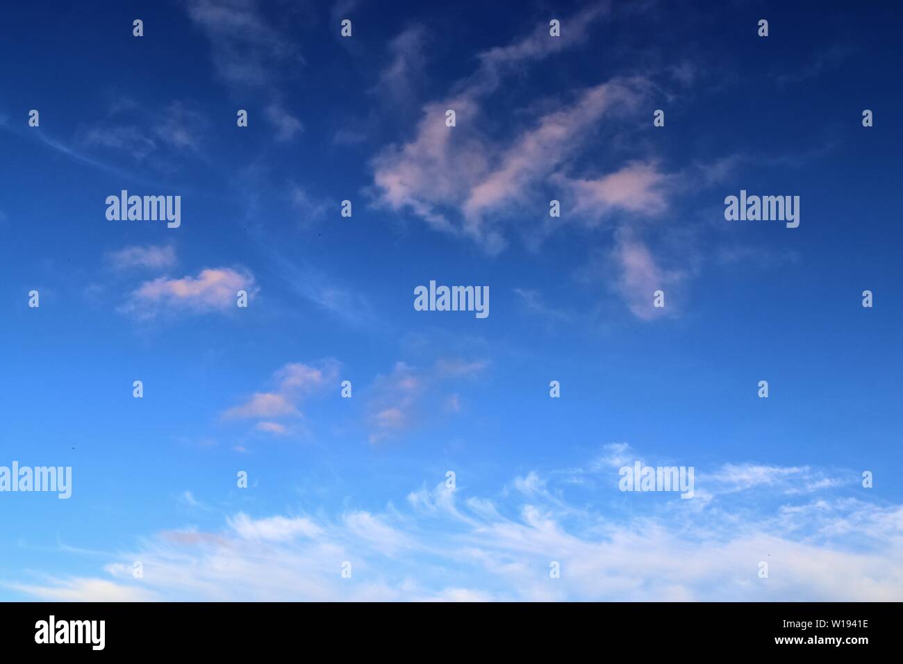 Beautiful cirrus cloud formations in a deep blue sky Stock Photo - Alamy