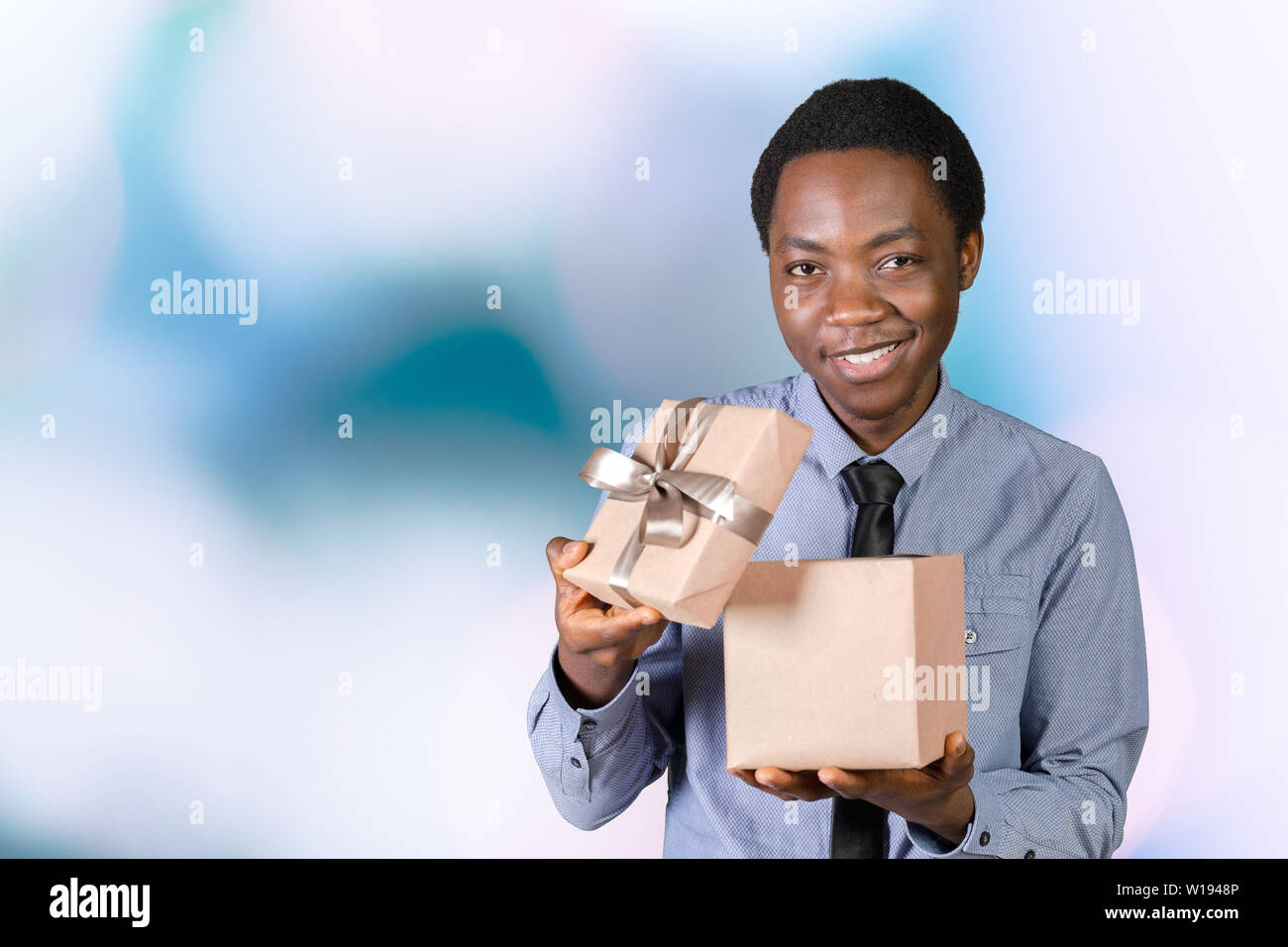 cool black man with a gift Stock Photo - Alamy