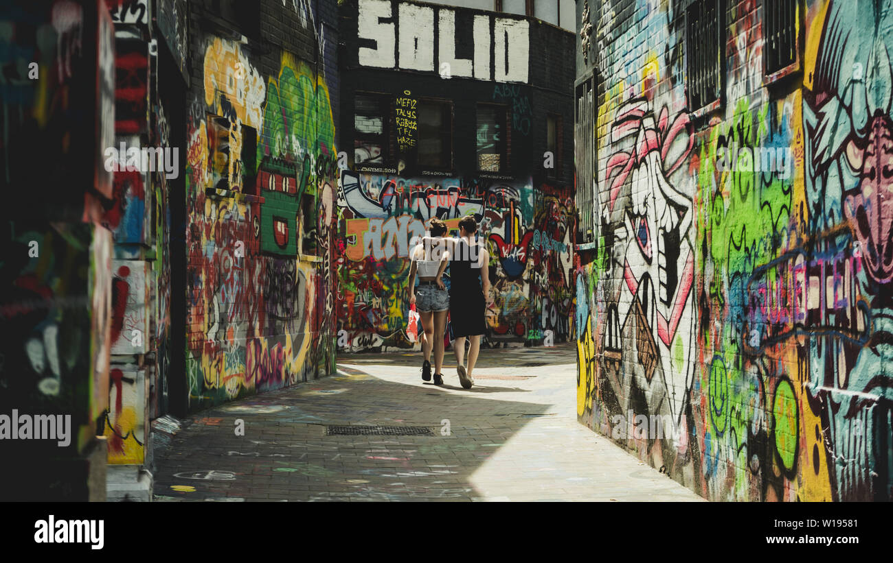 Couple walking down the Graffiti street in Ghent, Belgium Stock Photo ...