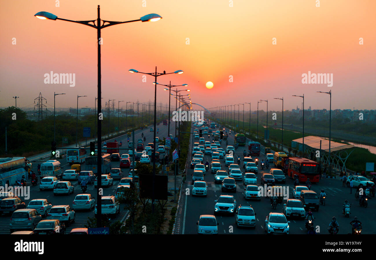 sunset with traffic on Highway at New Delhi,India Stock Photo - Alamy