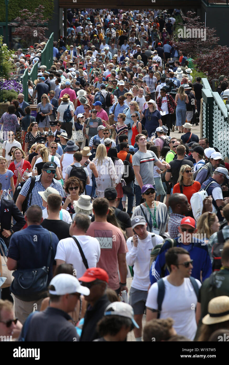 Spectators make their way around the grounds on day one of the ...