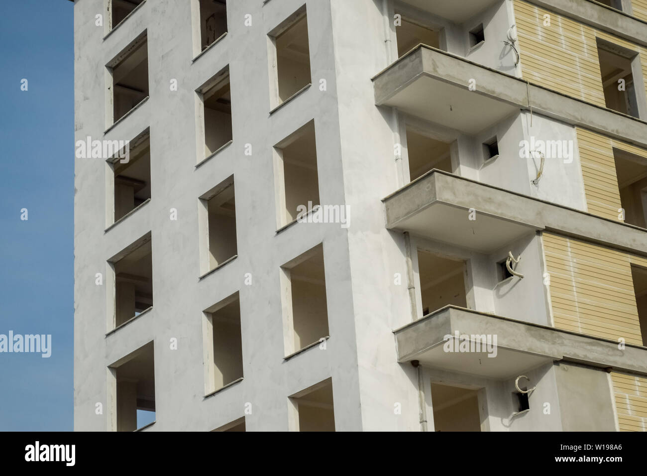 Unfinished new high-rise buildings. Building against the blue sky Stock ...