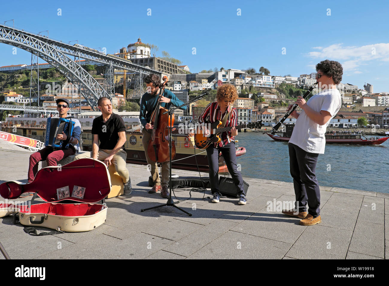 Mazei Portuguese street musicians playing instruments on River Douro ...