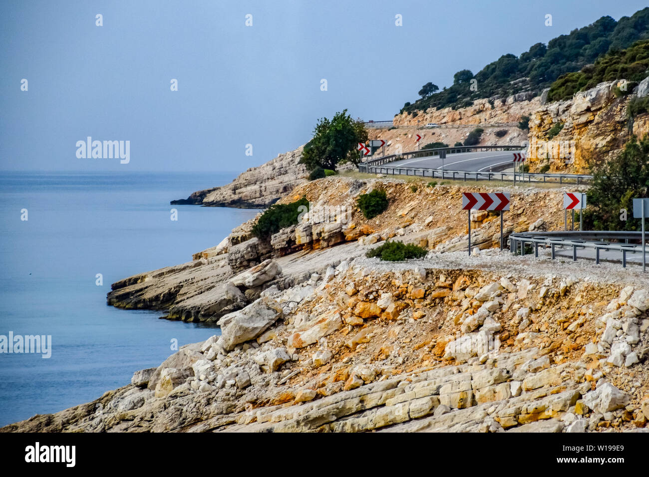 Sedimentary rocks of limestone and white marble on the shores of the ...