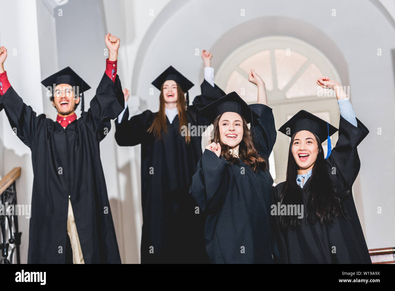 Graduates celebrating hi-res stock photography and images - Alamy