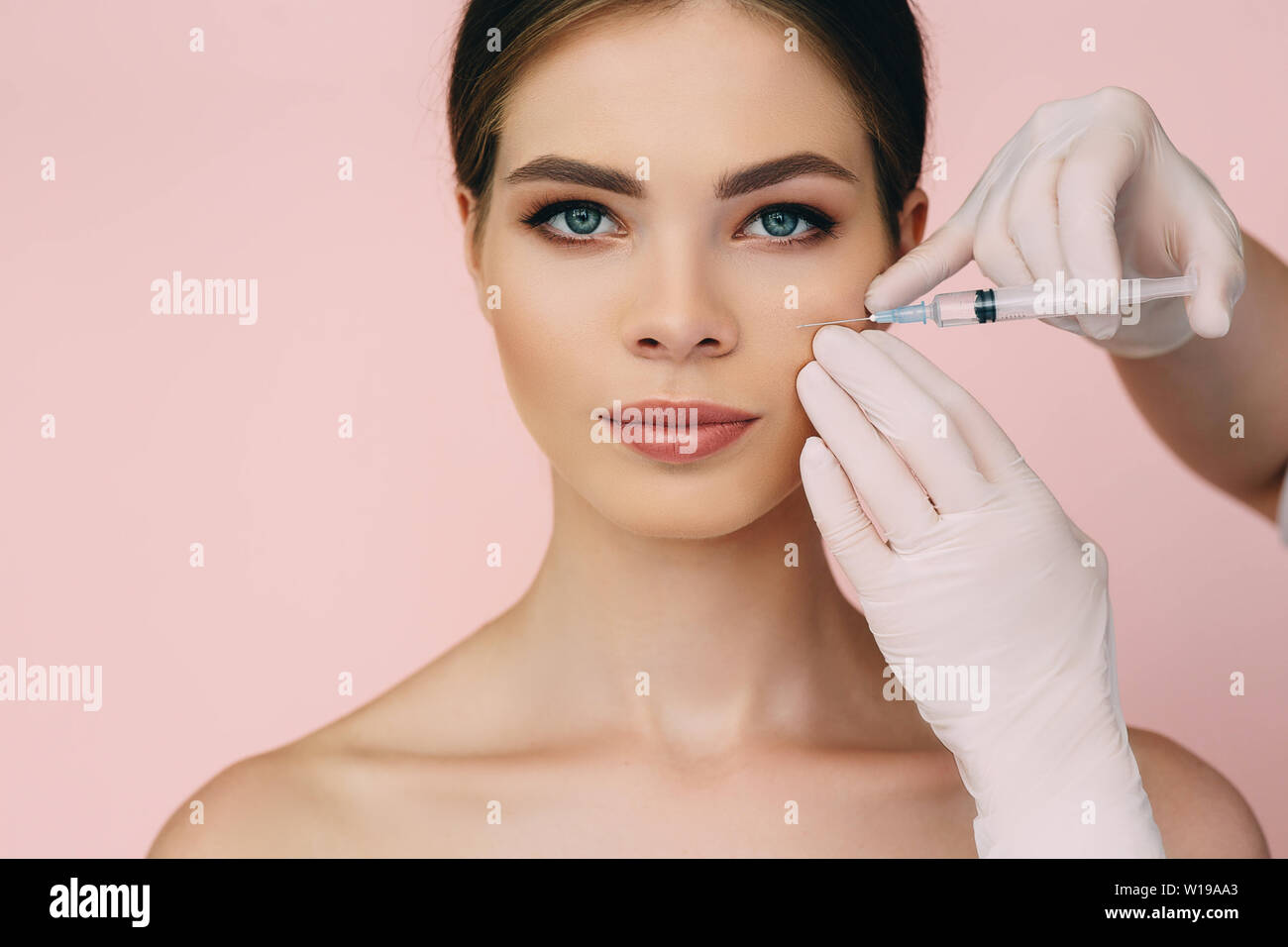 woman with perfect face having facial injections , biorevitalization ...