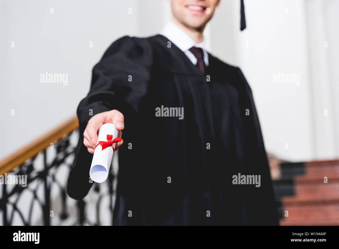 Diploma in hand hi-res stock photography and images - Alamy