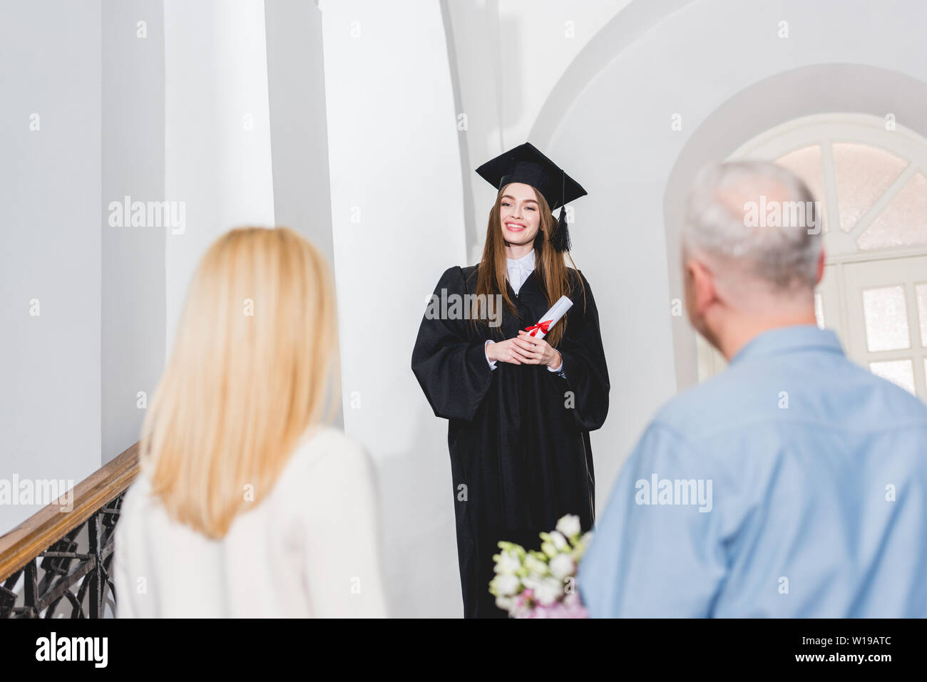 Mother father daughter graduation hi-res stock photography and images ...