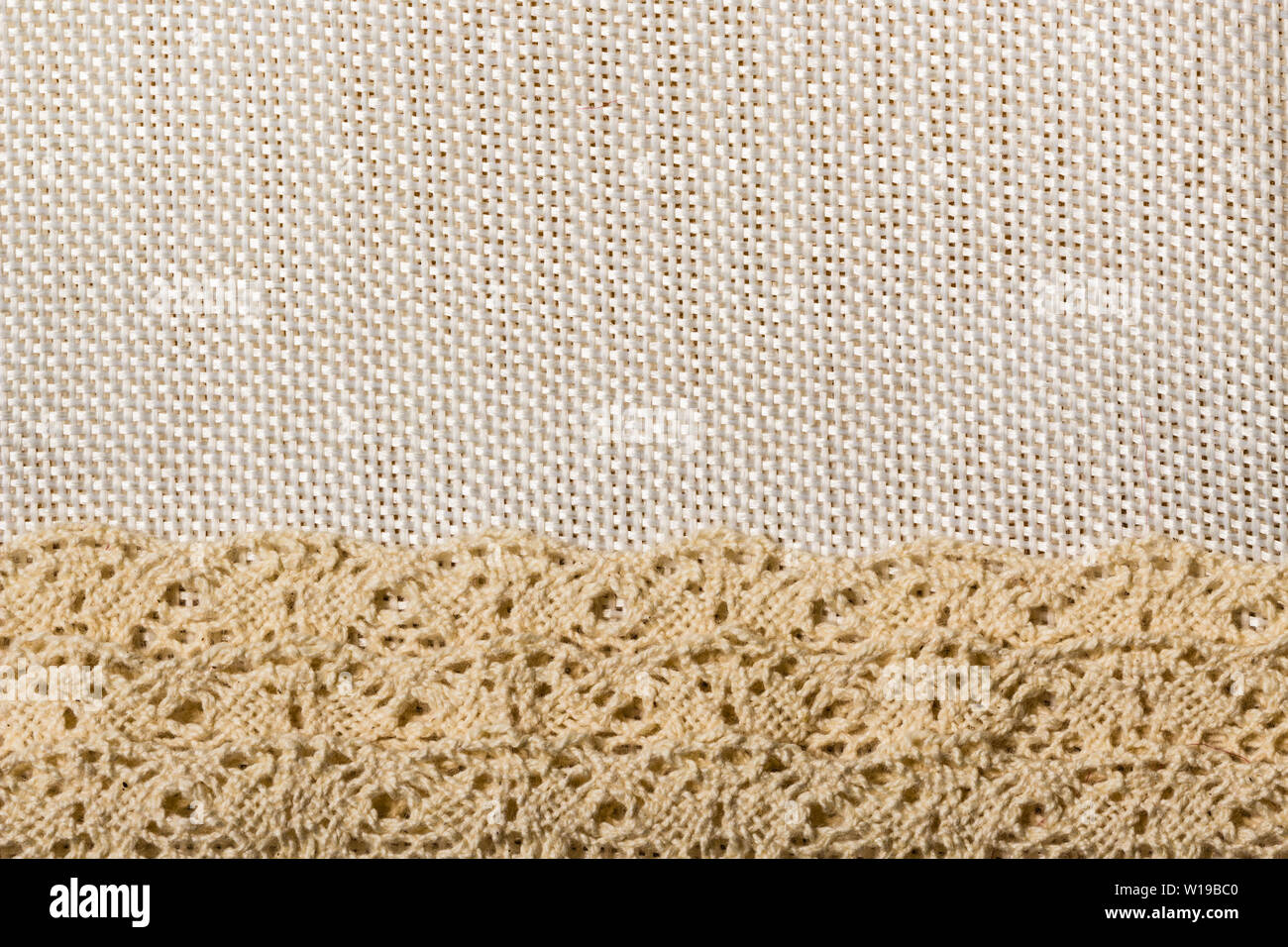 White lace ribbon frame on light material, sack cloth background Stock ...