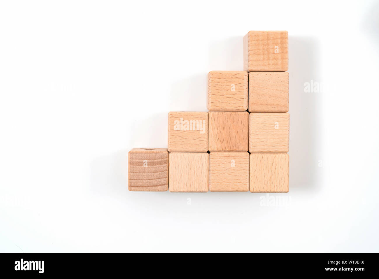 wood cube arrange in pyramid shape ,business concept Stock Photo - Alamy