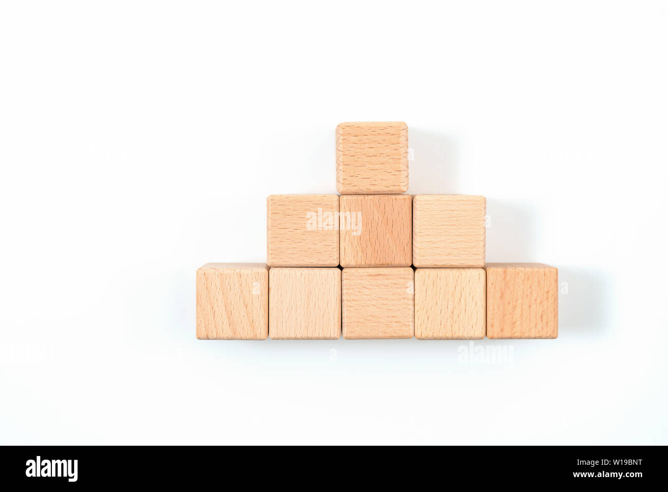 wood cube arrange in pyramid shape ,business concept Stock Photo - Alamy