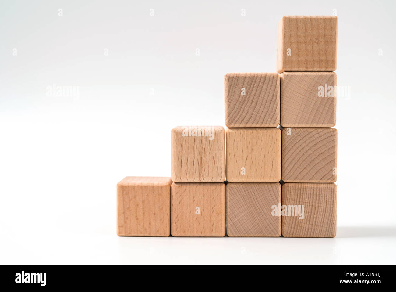 wood cube arrange in pyramid shape ,business concept Stock Photo - Alamy