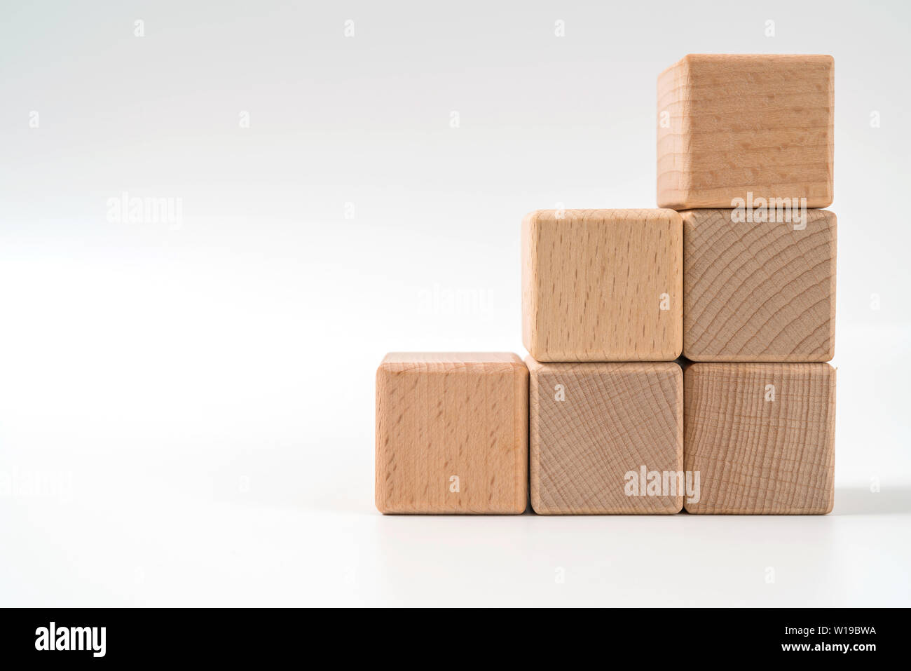 wood cube arrange in pyramid shape ,business concept Stock Photo - Alamy