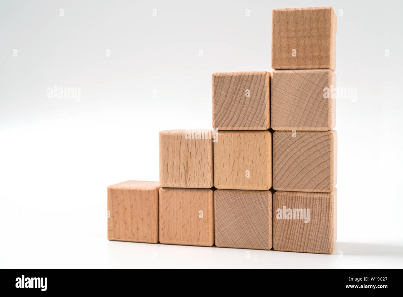 wood cube arrange in pyramid shape ,business concept Stock Photo - Alamy