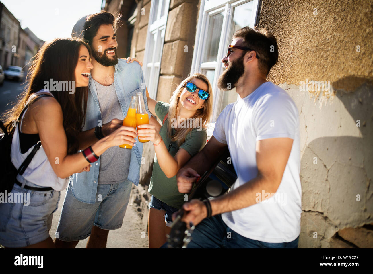 Group of young friends having fun together outdoor Stock Photo - Alamy