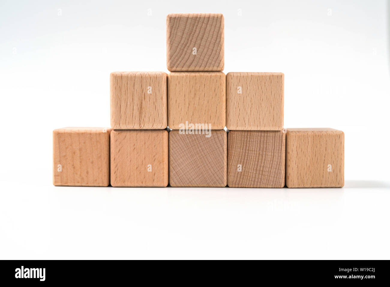 wood cube arrange in pyramid shape ,business concept Stock Photo - Alamy