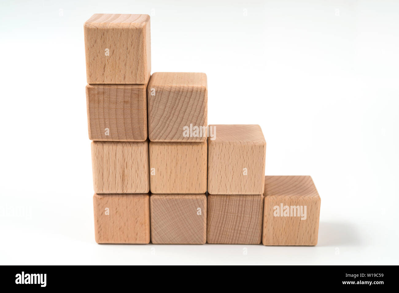 wood cube arrange in pyramid shape ,business concept Stock Photo - Alamy