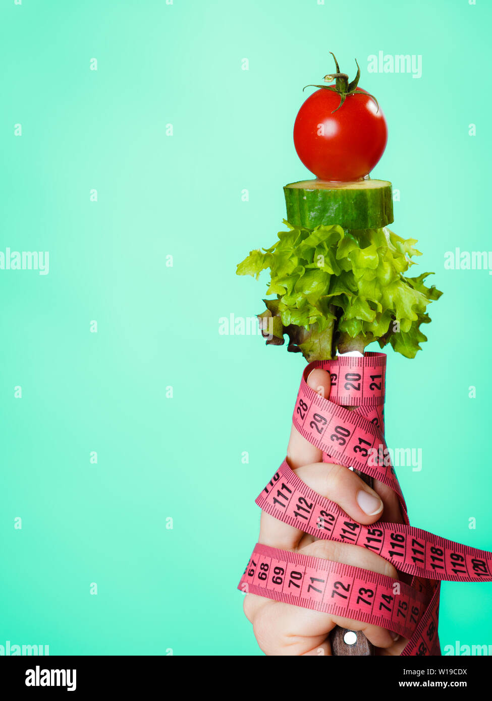 Diet and weight loss concept. Dietician woman hand with vegetarian food ...