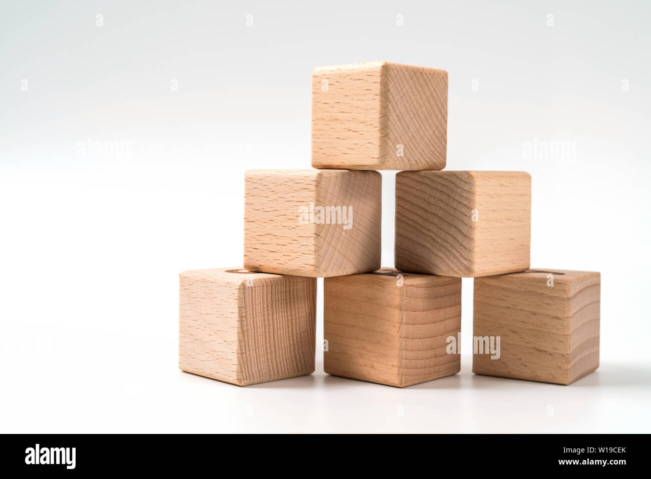 wood cube arrange in pyramid shape ,business concept Stock Photo - Alamy