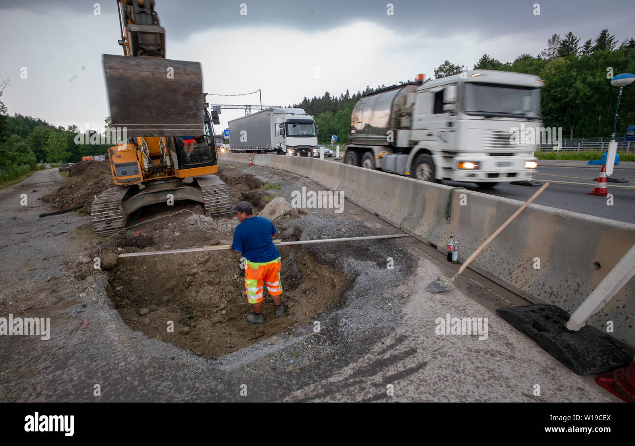 Piding, Germany. 01st July, 2019. Excavators are working on the third ...