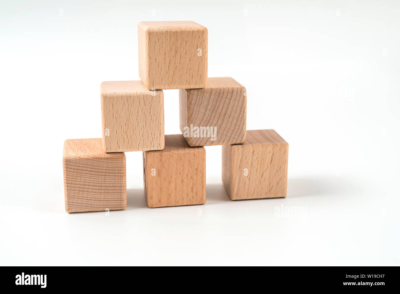 wood cube arrange in pyramid shape ,business concept Stock Photo - Alamy