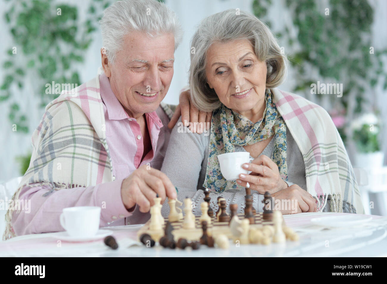 Old man woman playing chess hi-res stock photography and images - Alamy