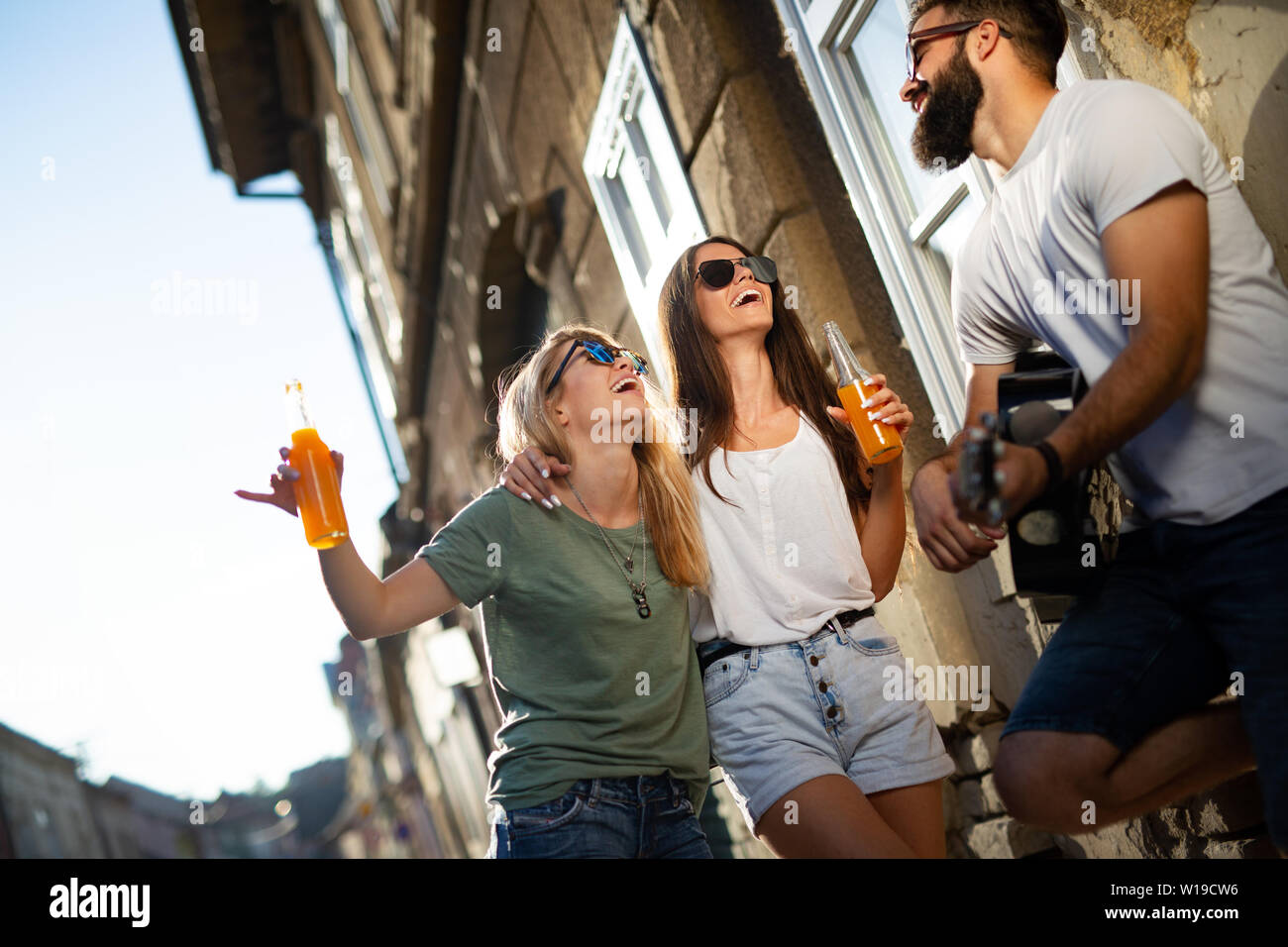 Group of young friends having fun together outdoor Stock Photo - Alamy