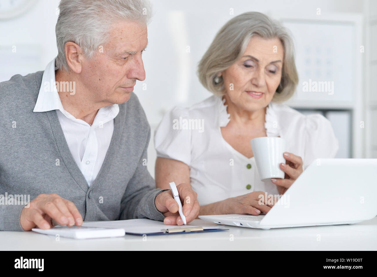 Senior couple working desk woman hi-res stock photography and images ...