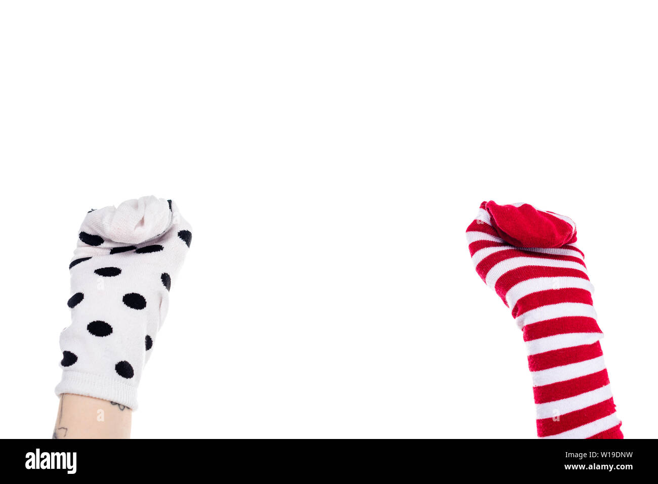 partial view of person with colorful sock puppets on hands Isolated On ...